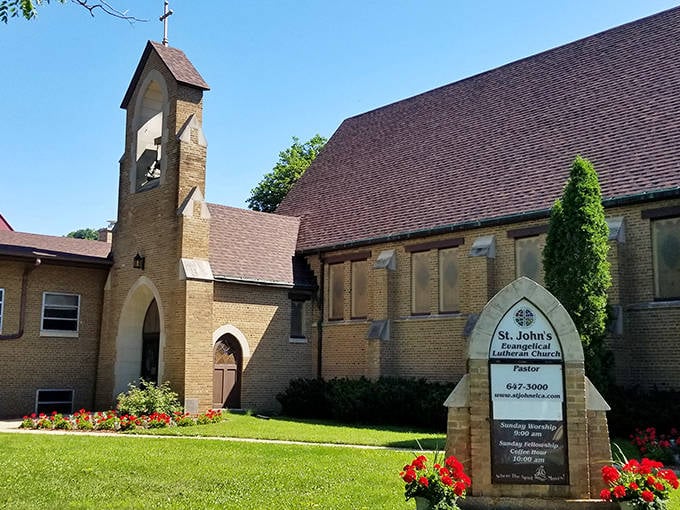 St. John's Lutheran Church stands as both spiritual anchor and architectural gem. Those flowers aren't just planted&mdash;they're tended with the same care as the congregation.