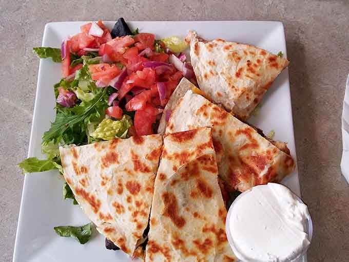 Steak and chicken quesadilla with fresh salsa proves fusion cuisine works beautifully when executed with care and quality ingredients.