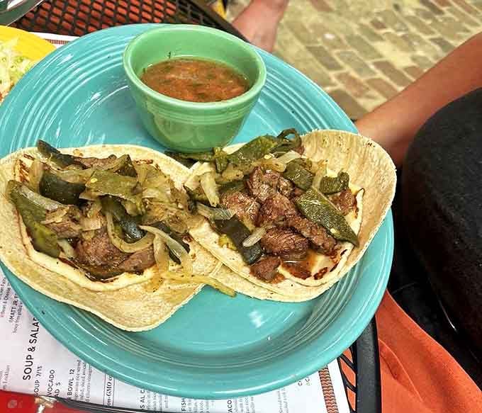 These street-style tacos don't need fancy outfits to impress&mdash;just hand-pressed tortillas, perfectly seasoned meat, and a splash of salsa verde.