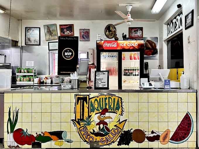 The colorful tiled counter with its cheerful rooster mascot sets the tone for authentic Mexican hospitality ahead.
