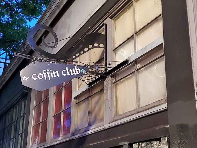 The coffin-shaped sign beckons passersby into this underground haven where Halloween never has to end for anyone.