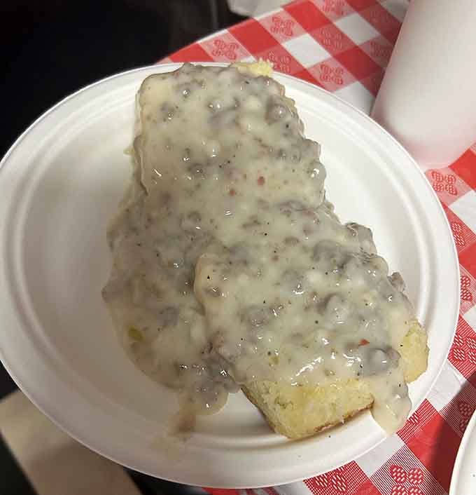 Biscuits smothered in sausage gravy represent everything good and right about Southern breakfast traditions done properly.