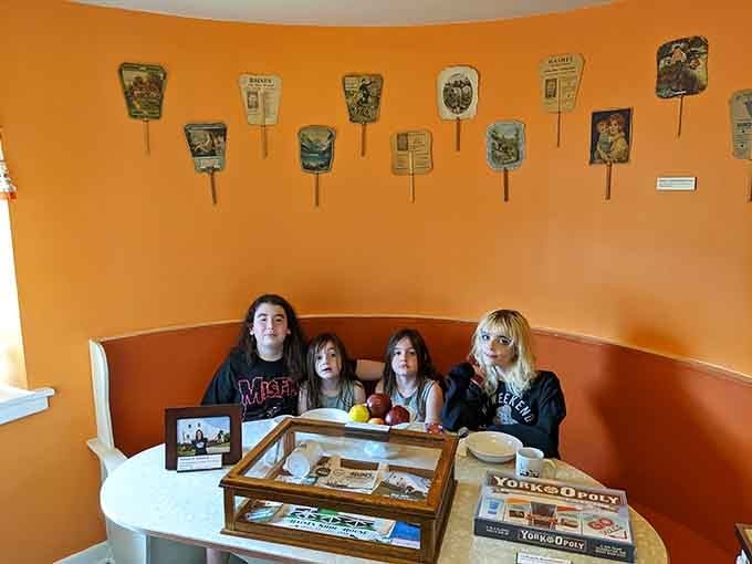 Inside, the orange walls and vintage fans create a retro vibe that's pure nostalgic charm.