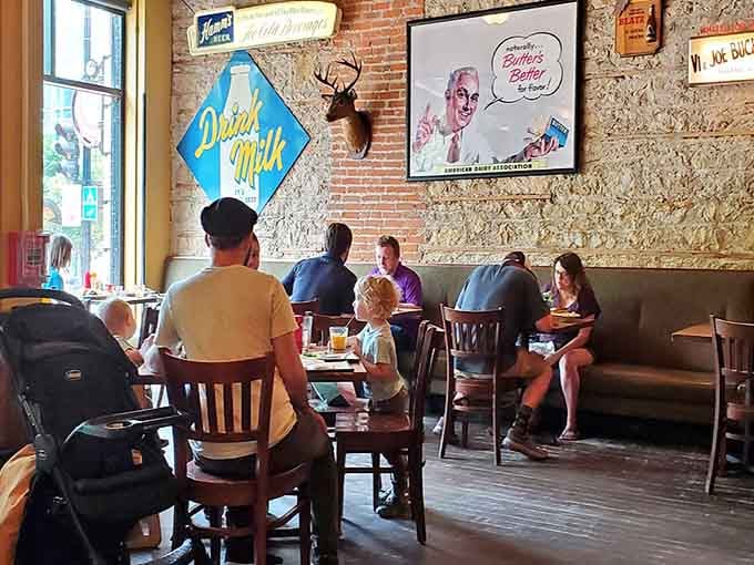 Exposed brick, vintage signs, and happy diners create the kind of atmosphere where memories are made daily.