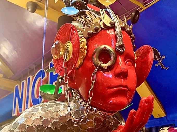 This red face adorned with kitchen utensils perfectly captures the restaurant's commitment to organized chaos everywhere.