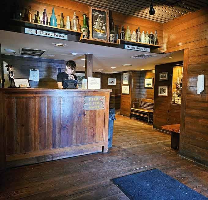 That rustic wooden host stand has probably greeted more guests than most hotels, and it shows in the best way.