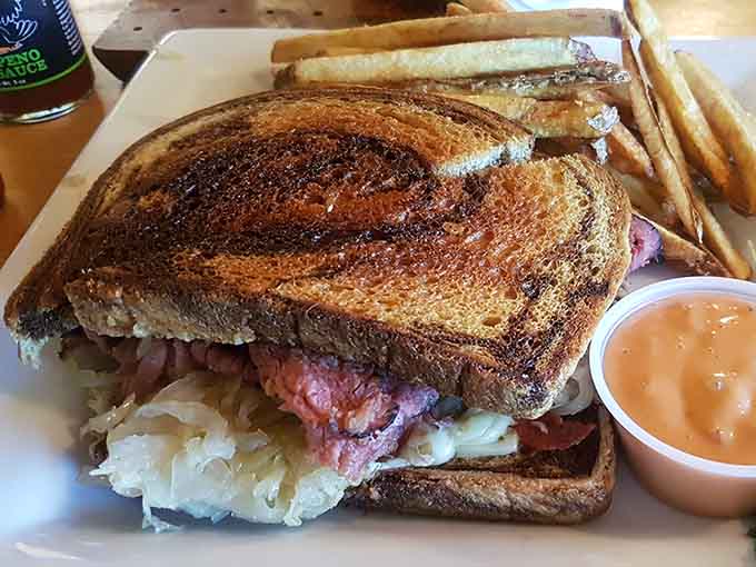 Reuben on marbled rye that's bigger than your head, proving the portions match the audacity of the menu names.