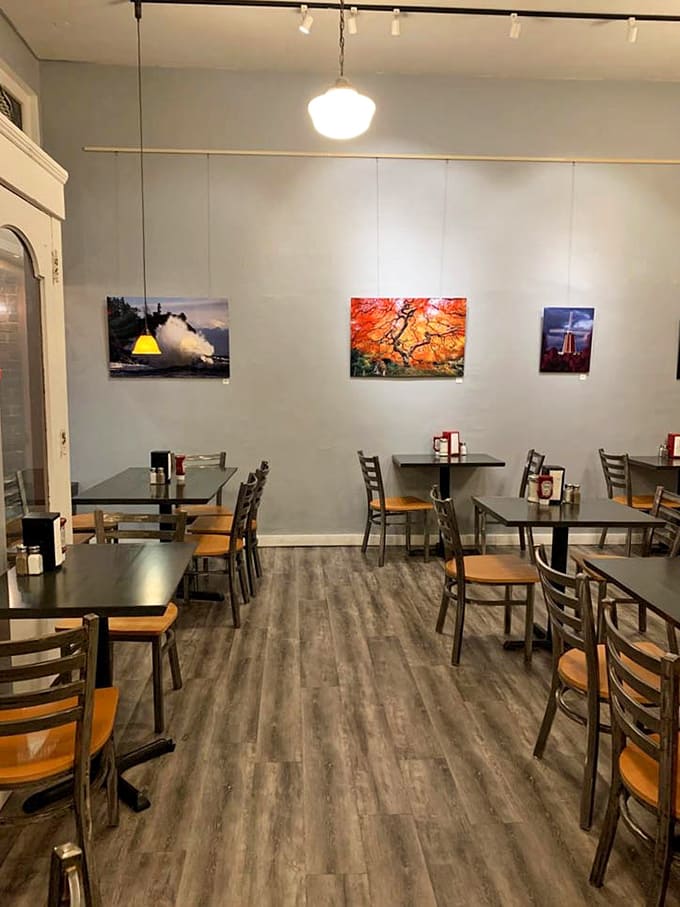 Clean, simple dining space with photography on the walls and plenty of tables for the breakfast crowd.