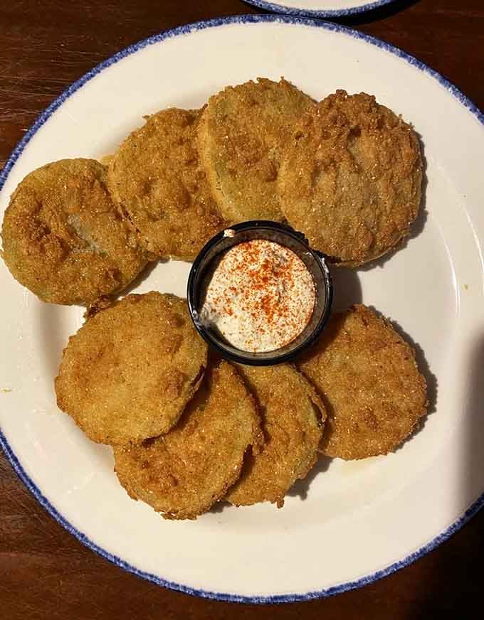 Fried green tomatoes arranged like edible art, proving that Southern appetizers deserve their own museum wing somewhere.