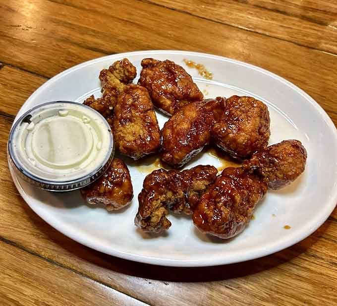 Golden wings glazed to perfection, ready to disappear faster than your willpower around good bar food.