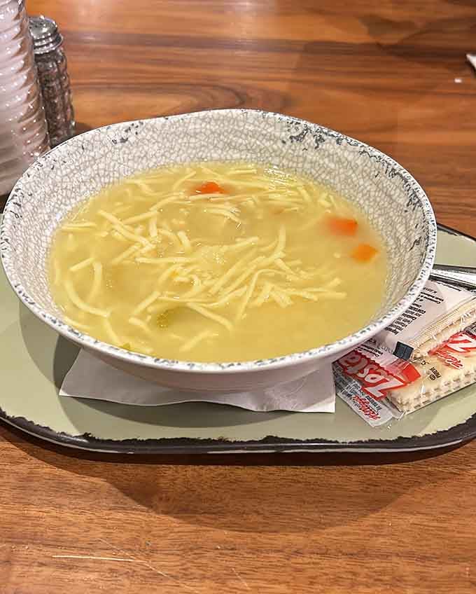 Classic chicken noodle soup served in a proper bowl, because some comfort foods never go out of style.