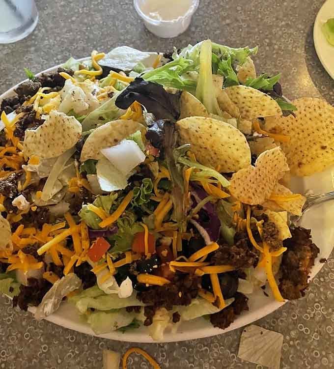 This taco salad towers like a delicious Jenga game you actually want to collapse immediately.