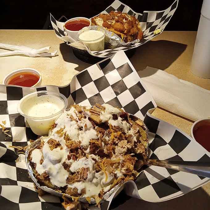 That loaded baked potato situation looks like someone's wildest comfort food dreams came true in edible form.