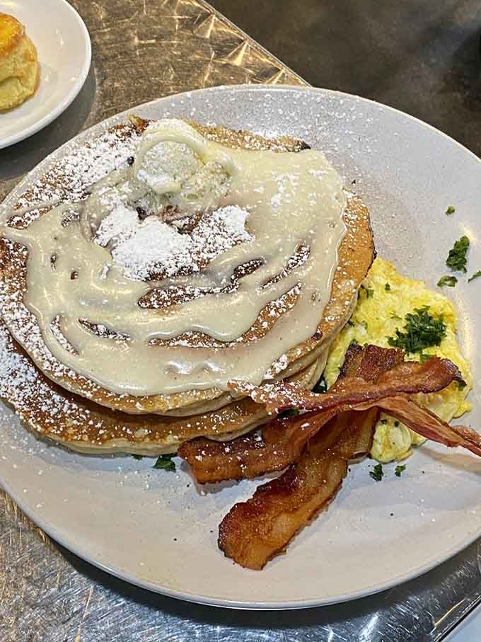 Sweet potato pancakes stacked high with whipped cream, because sometimes more is actually more, not less.