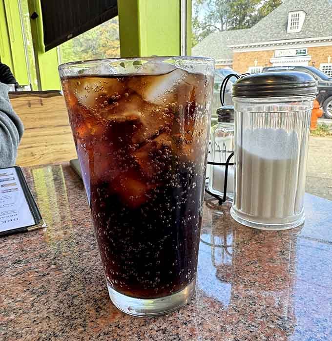 Ice-cold cola in a tall glass, because the perfect breakfast beverage is whatever makes you happy.