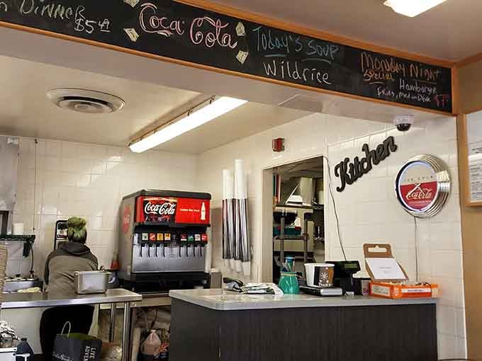 The order counter where magic happens, complete with a Coca-Cola fountain and dreams coming true in real time.