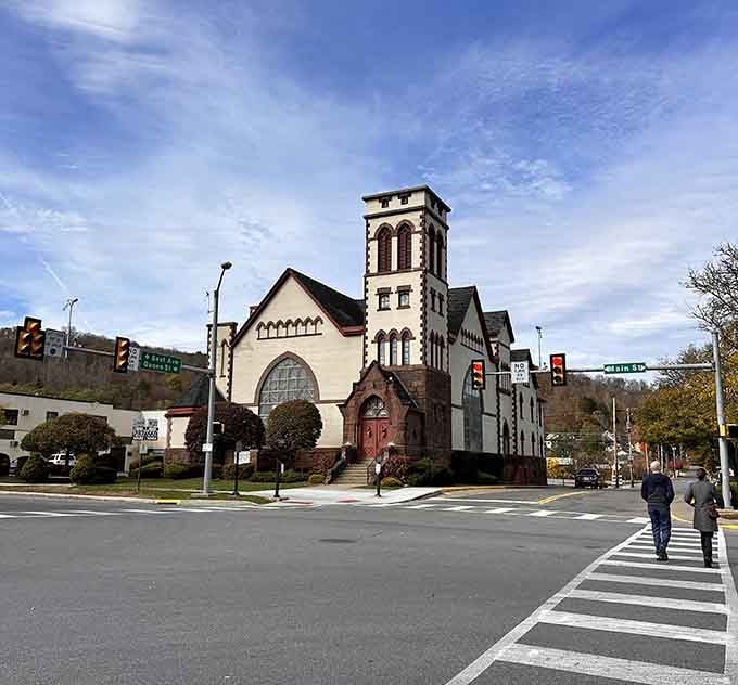 That church tower reaches skyward like it's trying to have a conversation with the clouds passing overhead.