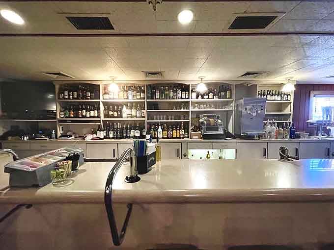 The well-stocked bar stands ready to mix your favorite drink while you wait for your table and contemplate life's pleasures.