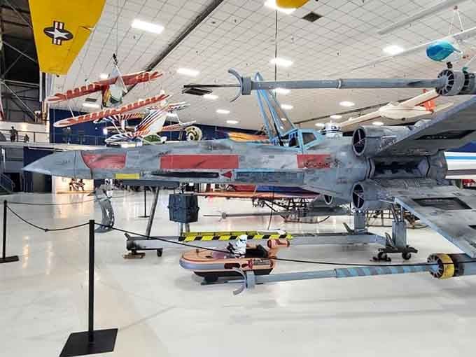 Yes, that's an actual Star Wars X-wing fighter sitting next to real military jets, because dreams belong here too.