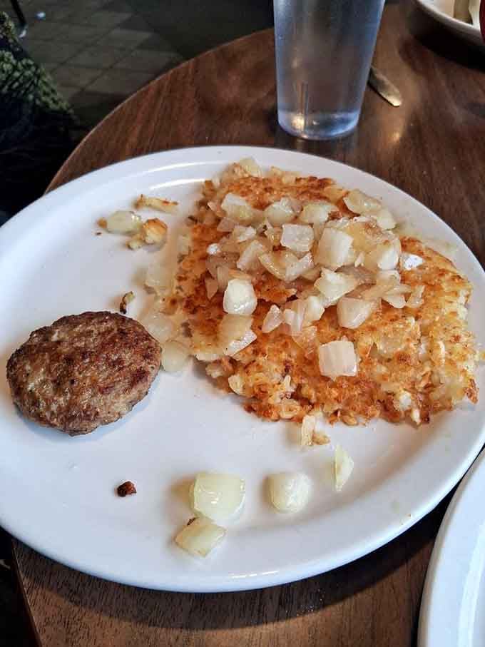 Crispy hash browns with a sausage patty sidekick represent the simple pleasures that make mornings worth experiencing.