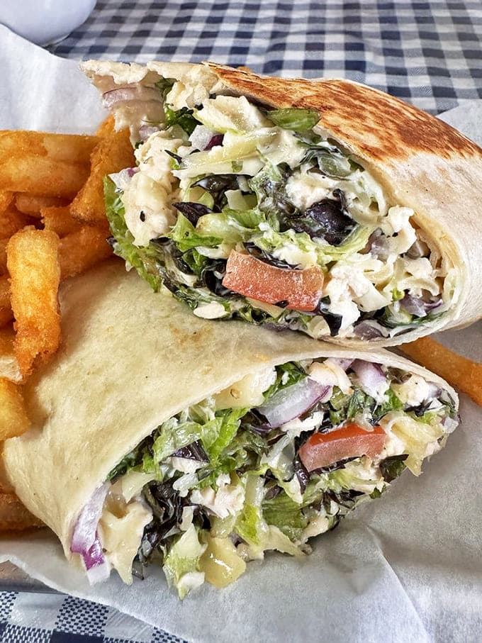 This wrap isn't just lunch; it's a masterclass in texture and flavor, with each bite delivering a perfect balance of creamy and crunchy.