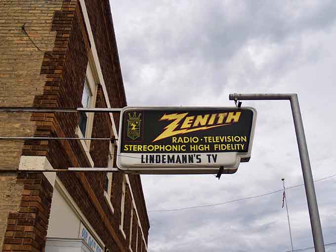 Lindemann's TV sign advertises Zenith products, a nostalgic reminder of when buying a television was a once-a-decade family decision.
