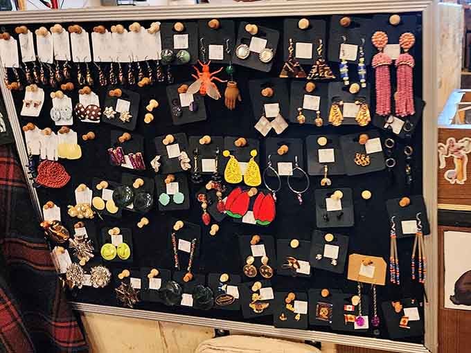 This wall of earrings isn't just jewelry—it's a museum of miniature art pieces waiting to dangle from your lobes and into conversations.