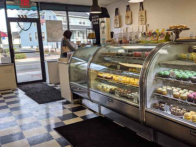 The curved display case gleaming with treats is like a treasure chest, except everything inside is edible.