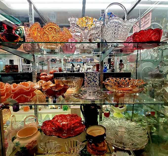 Carnival glass and crystal catch the light like jewels in a treasure chest. Each piece represents craftsmanship rarely seen in today's mass production.