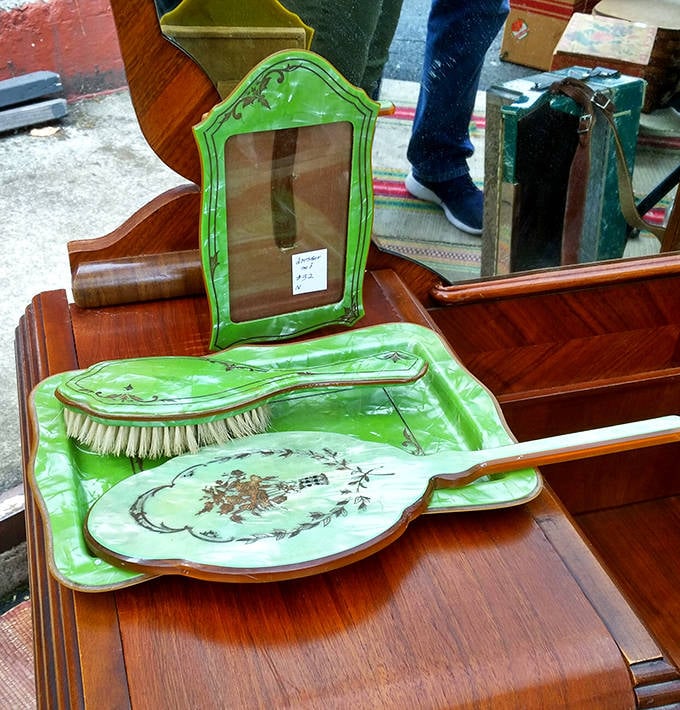 This vintage vanity set in lime green ceramic whispers tales of 1950s boudoirs and glamorous morning routines from a more elegant era.