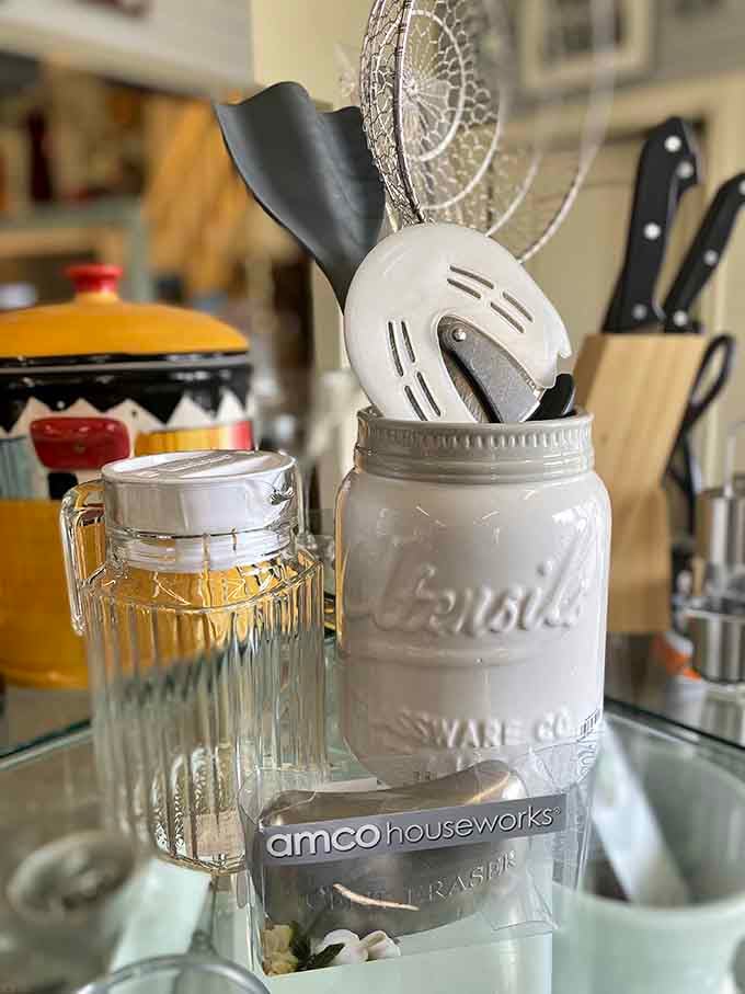 Kitchen tools with character and history. That mason jar isn't just holding utensils &ndash; it's holding the potential for your next culinary masterpiece.