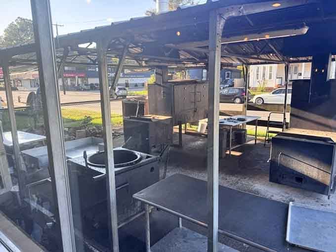 Where the magic happens&mdash;smokers and grills visible through the window. This isn't a kitchen; it's a laboratory where time, smoke, and meat create edible alchemy.