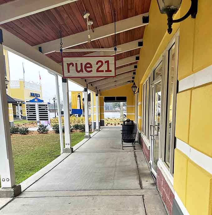 Rue21's hanging sign guides fashion-forward bargain hunters down covered walkways. The wooden ceiling adds rustic charm to your urban shopping expedition.