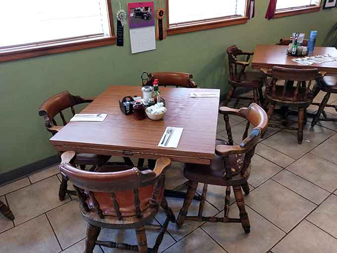 Green walls and wooden tables create a cozy atmosphere where locals gather to fuel up for mountain adventures.