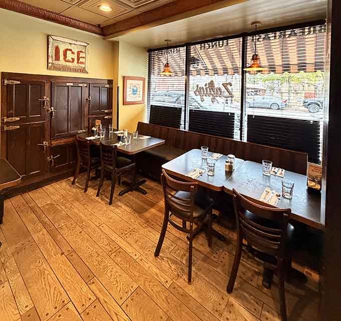 Corner tables at Zaftigs aren't just seating&mdash;they're real estate with stories to tell. Wood floors and warm lighting create the perfect backdrop for solving the world's problems over kugel.