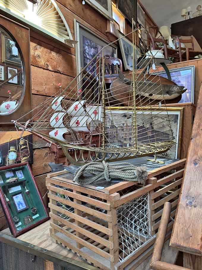 This intricate model ship sails on a sea of nostalgia, surrounded by the kind of maritime treasures that make landlubbers dream of adventure.