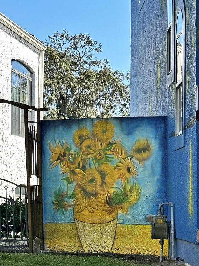 Not just one masterpiece! Van Gogh's famous "Sunflowers" makes a brilliant appearance, bringing golden warmth to a tucked-away corner of the property.