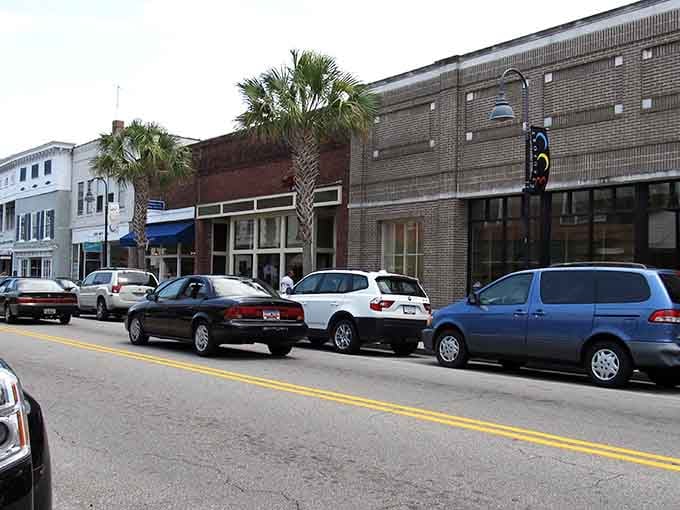 Palm trees punctuate a streetscape where historic buildings house the businesses that keep communities thriving together.
