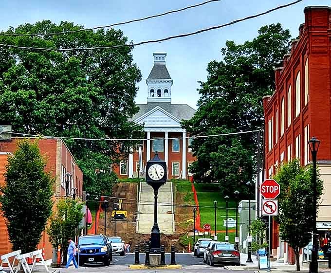 That charming clock and courthouse view up the hill creates a scene straight from a classic movie about American small towns.