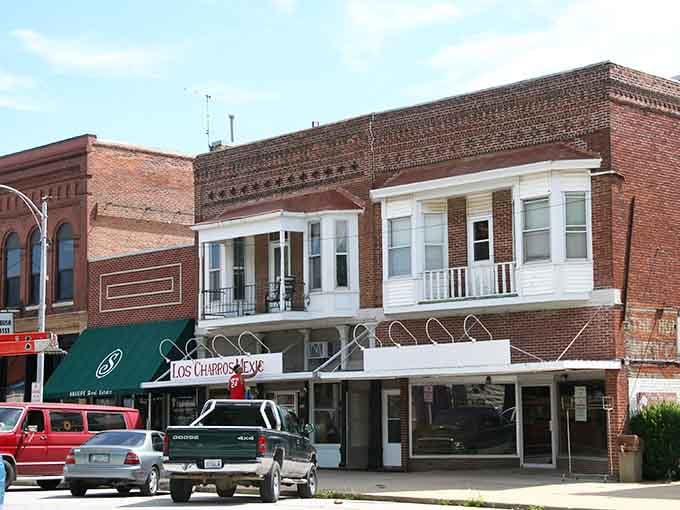 Upper-story porches on these vintage buildings suggest a time when people watched the world go by without staring at screens.