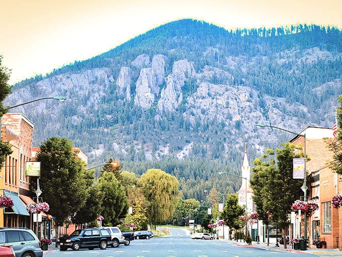 Mountains rise behind Main Street like nature's version of a movie screen, providing free entertainment since forever.