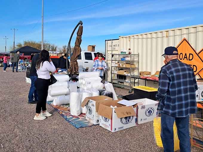 Early morning shoppers arrive as vendors arrange their wares in the cool dawn air before crowds gather.