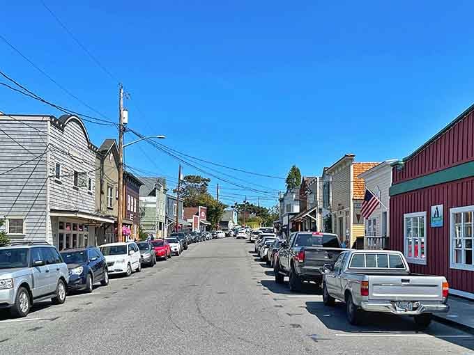 Painted buildings line the street in cheerful colors, proving that small towns can be vibrant without trying too hard.