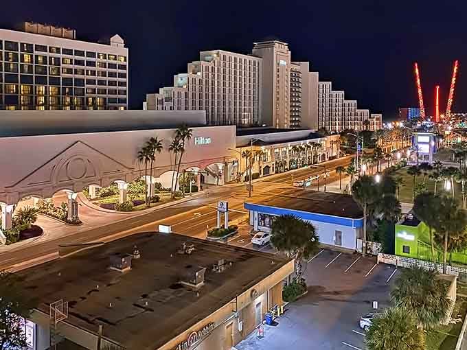 Nighttime transforms Daytona Beach into a neon-lit playground where palm trees sway and possibilities seem endless under starry skies.
