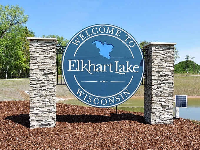 This welcoming sign promises crystal-clear waters and small-town charm, delivering on both with interest and a friendly Midwestern smile.
