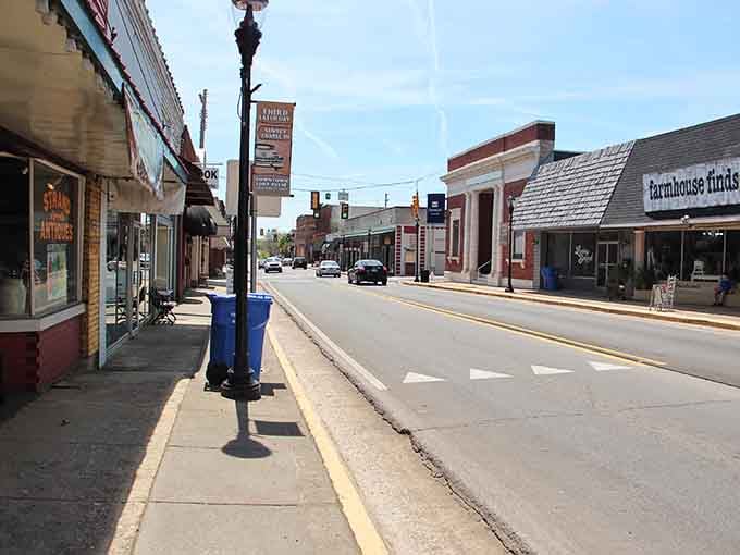 Brick buildings glow golden in afternoon light, each window reflecting decades of community life and memories.