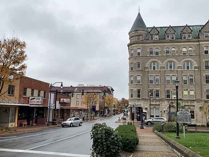 That grand corner building stands like a castle, proving that affordable towns can still have architectural treasures.