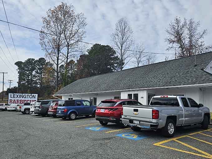 That packed parking lot on an overcast day tells the whole story: people drive from everywhere for this barbecue.