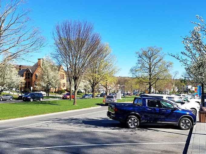 Spring green lawns and budding trees surround a town center that looks ready for a Sunday afternoon band concert.