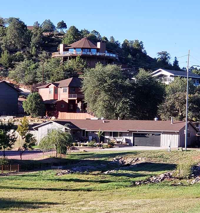 Hillside homes stacked like a Mediterranean village, proving Arizona's mountain towns have their own unique architectural personality.
